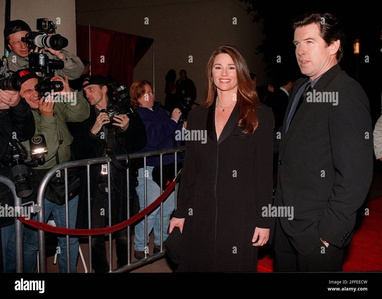 "Dantes Peak" star Pierce Brosnan arrives at the movie's premiere with ...