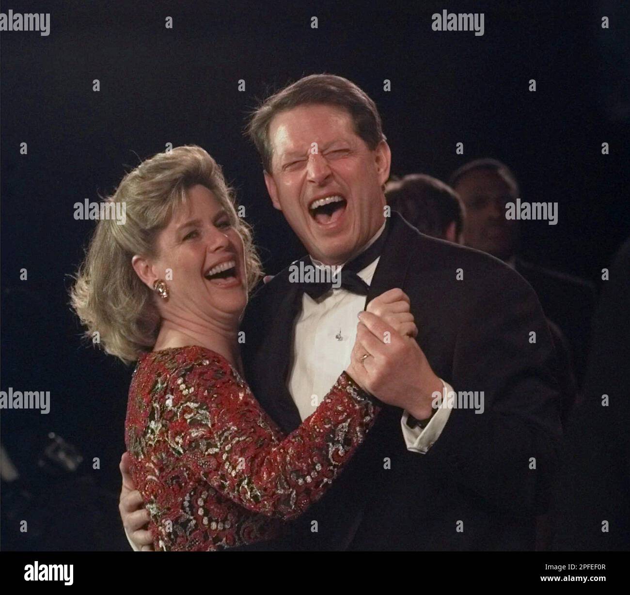 Vice President Al Gore laughs while dancing with his wife Tipper during ...
