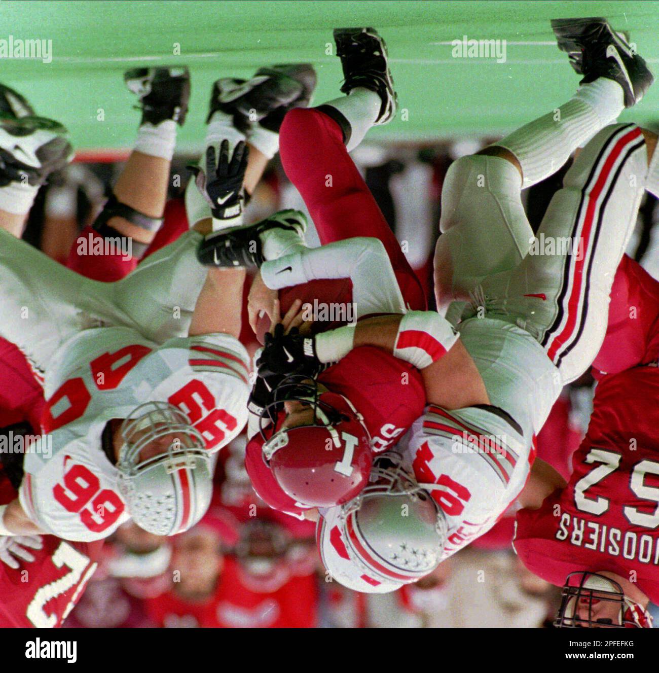 Ohio State's Mike Vrabel, left, sacks Indiana quarterback Jay Rodgers ...