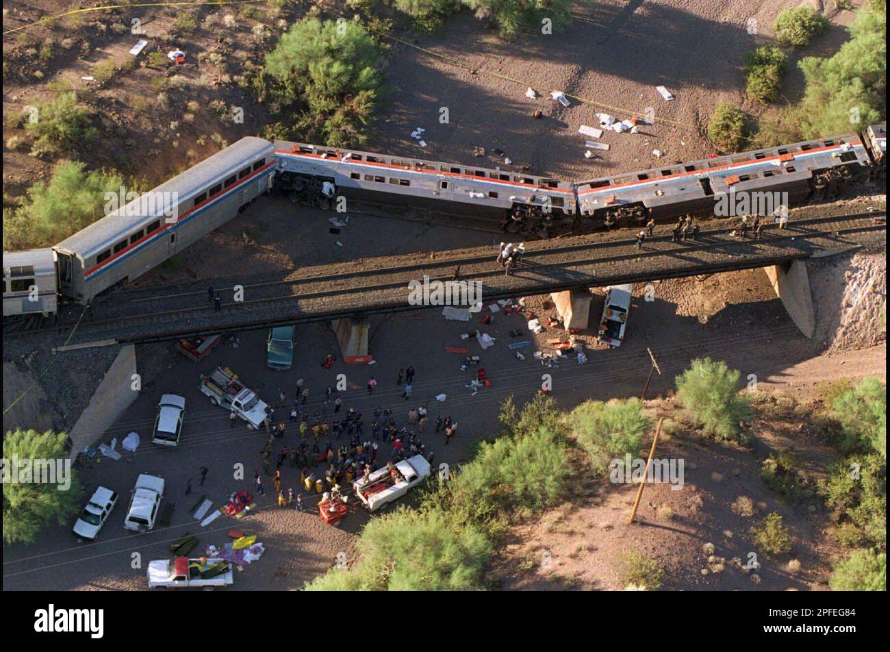 FILE--An Amtrak Sunset Limited train lies on its side in a creek bed ...