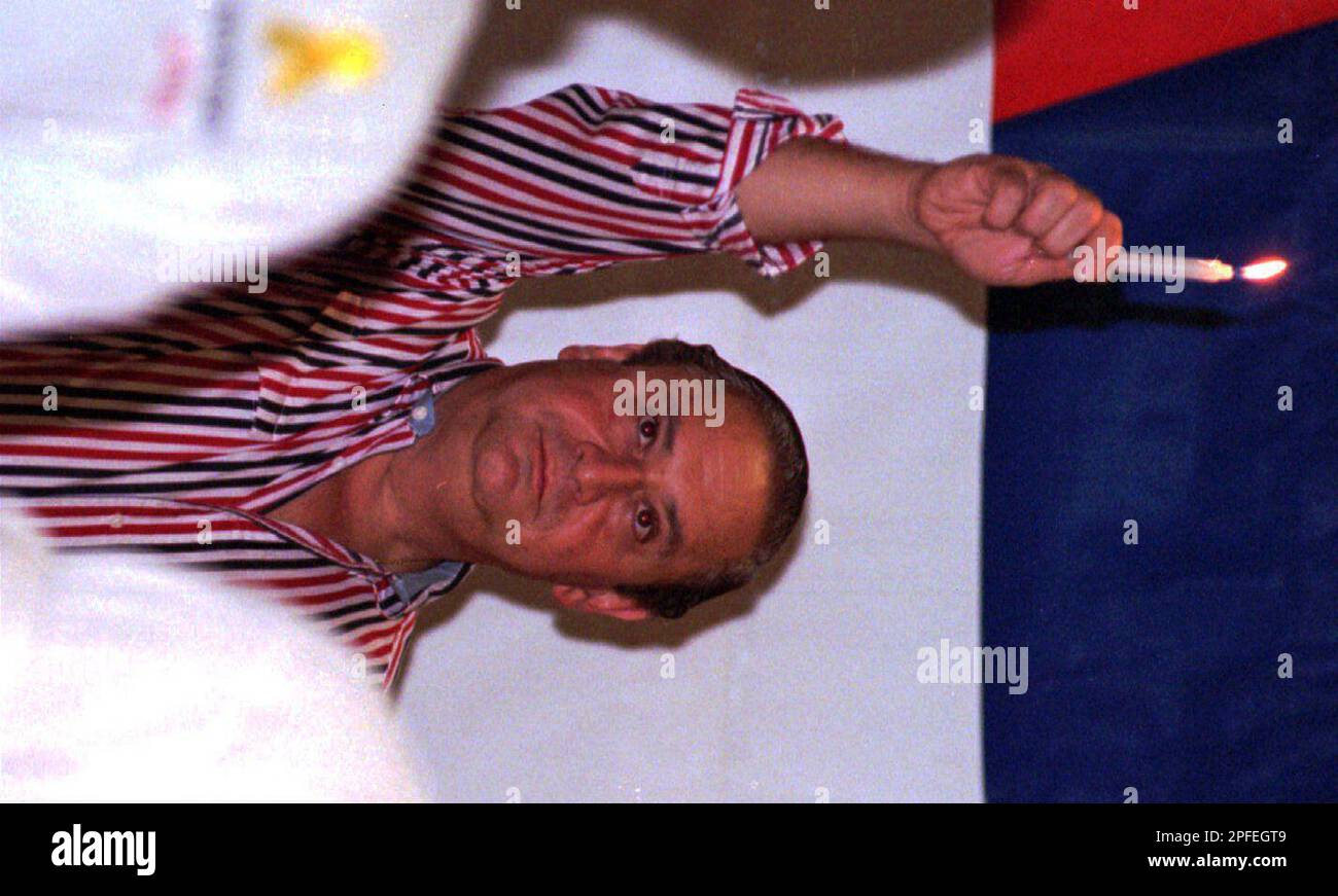 Salvadoran President Armando Calderon Sol raises a candle during a ...