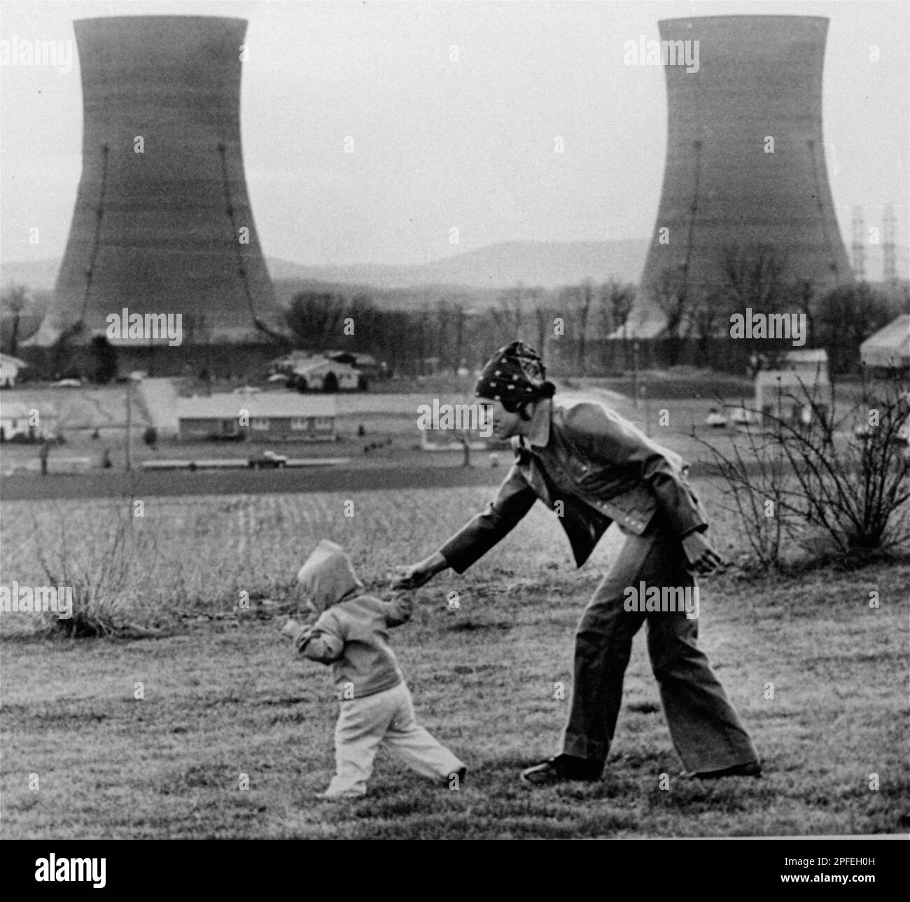 Mrs. Julie Sipling takes her daughter Debbie, 13 months, for a walk ...