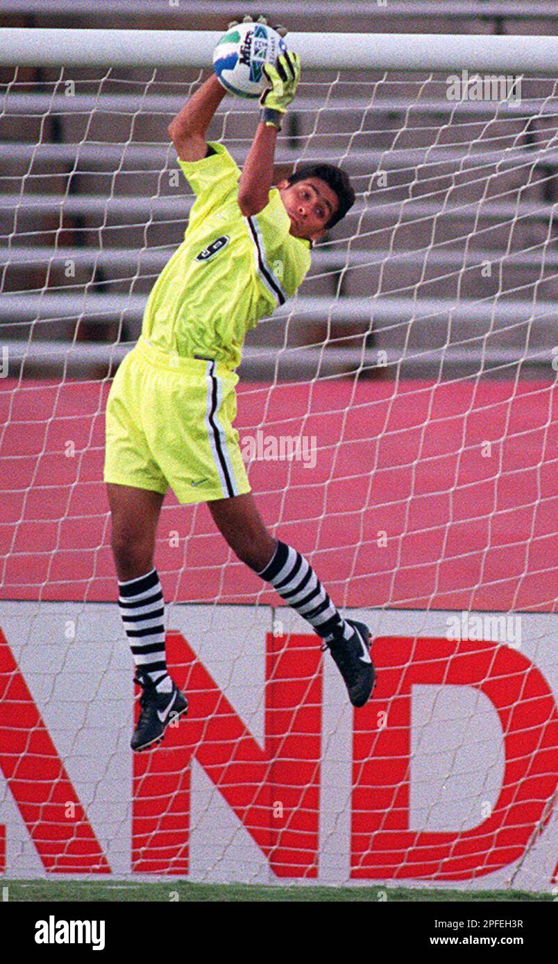 Los Angeles Galaxy' goalie Jorge Campos grabs a ball shot by an ...