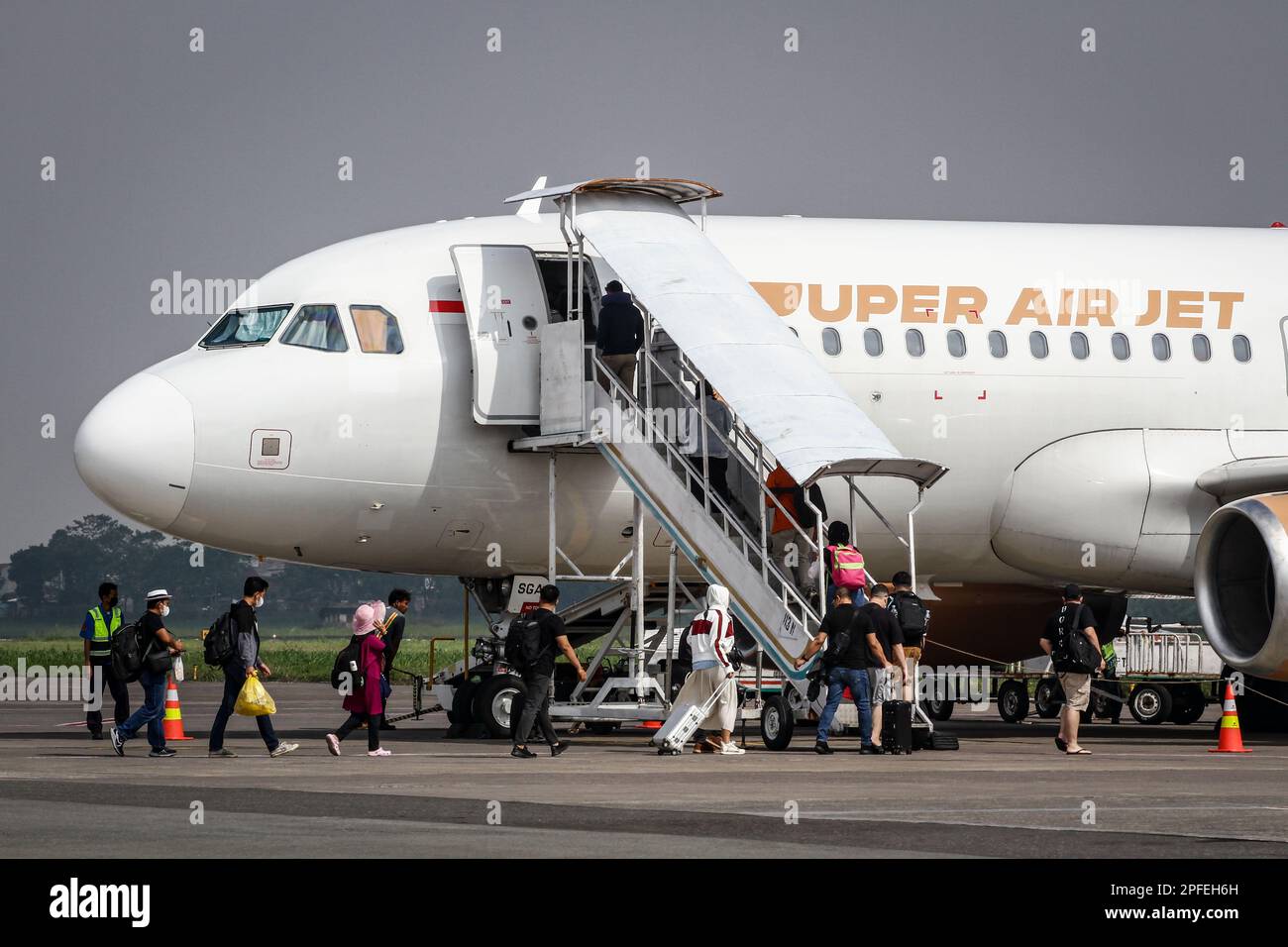 Bandung, West Java, Indonesia. 17th Mar, 2023. Passengers entering a Super Air Jet aircraft at ...