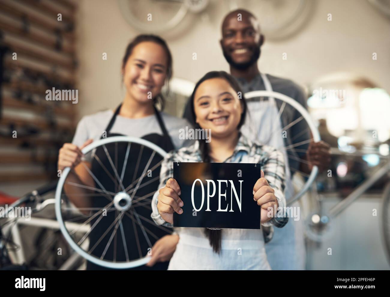 Let us take you on a ride, bring a helmet. Portrait of three workers ...