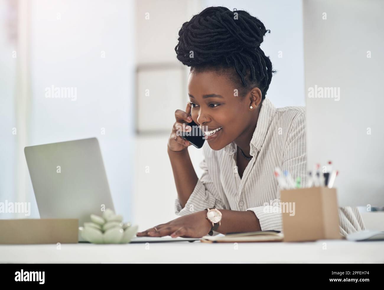 I look forward to seeing your work. a young businesswoman using her ...
