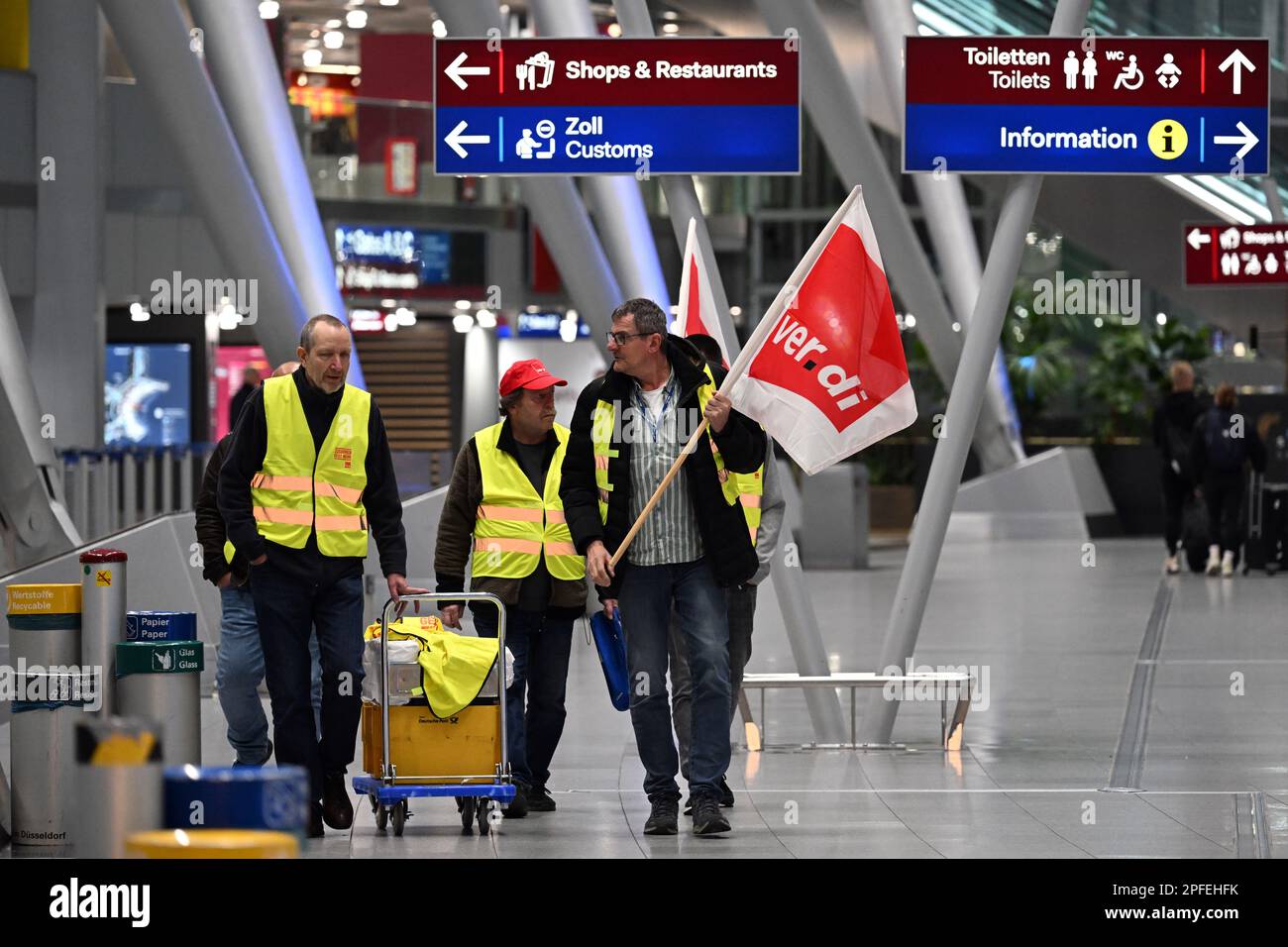 Duesseldorf, Germany. 17th Mar, 2023. Striking airport employees walk ...