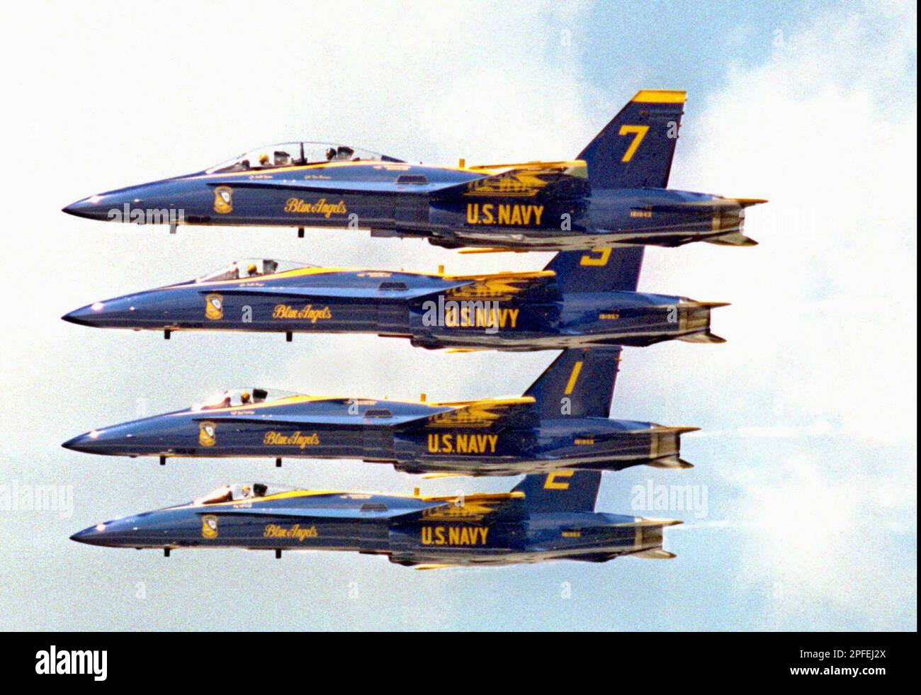 Four members of the Blue Angels flying team practice a line abreast ...