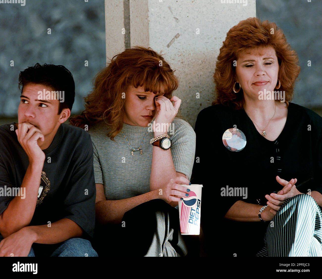 Kathy Wilburn waits with her daughter, Edye Smith, center, and son ...