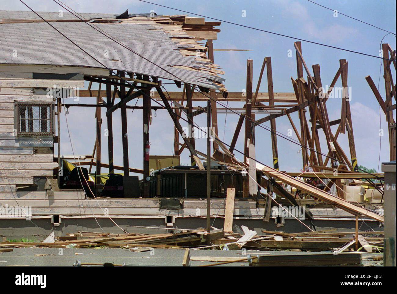 A warehouse heavily damaged by severe winds is seen at Fort Dix ...
