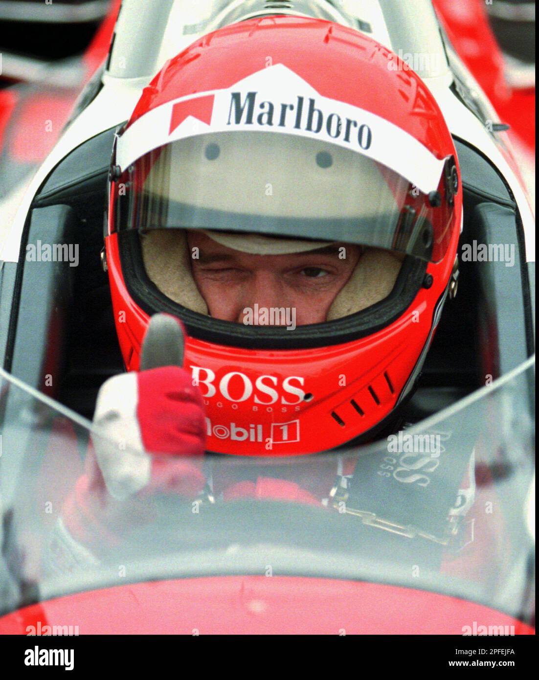 IndyCar driver Al Unser Jr. gives a wink and a thumbs up during ...