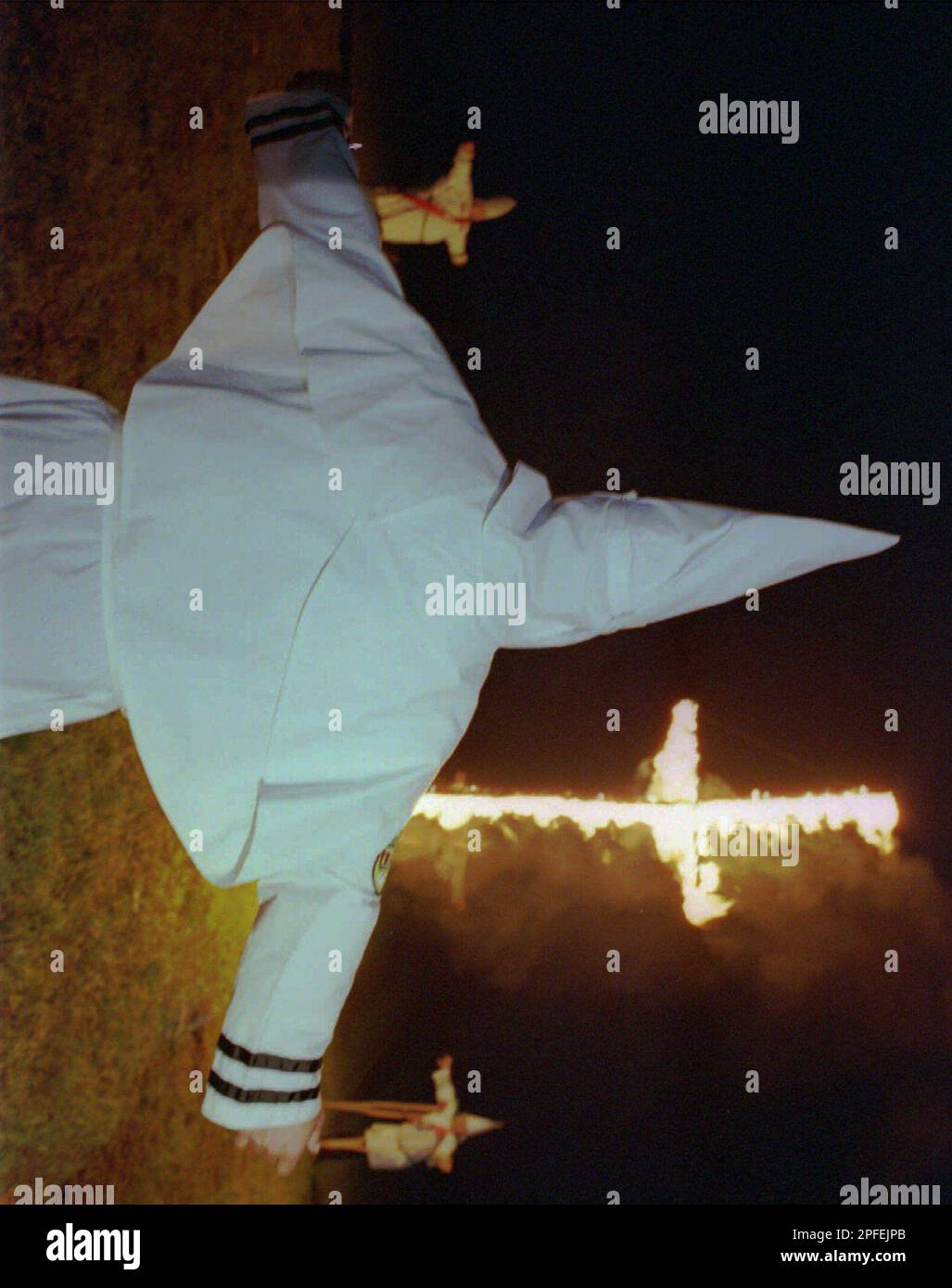 The Keystone Knights of the Ku Klux Klan salute the burning crucifix at ...