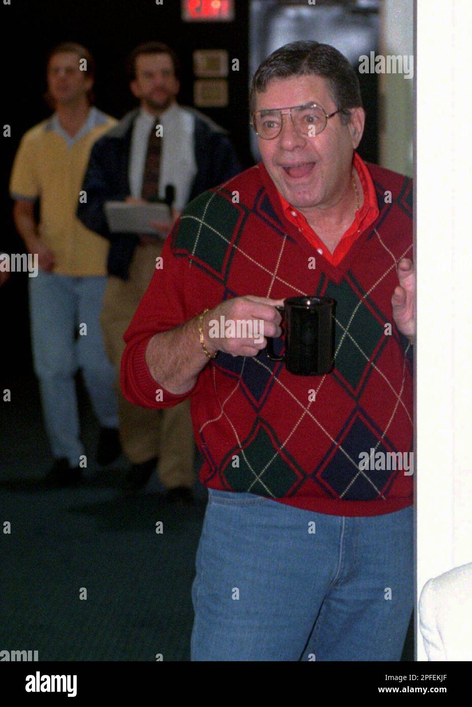 Comedian Jerry Lewis clowns for the cameras as he waits to be ...