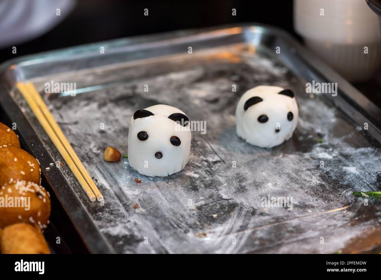 Panda shaped mantou Chinese steamed bun on a plate Stock Photo - Alamy
