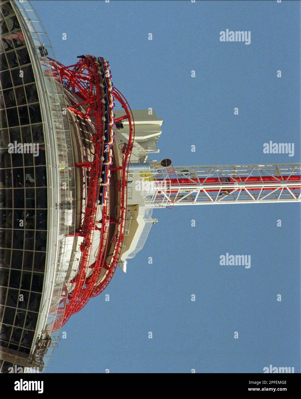 Workers add some final touches to the thrill-seeking roller coaster ...