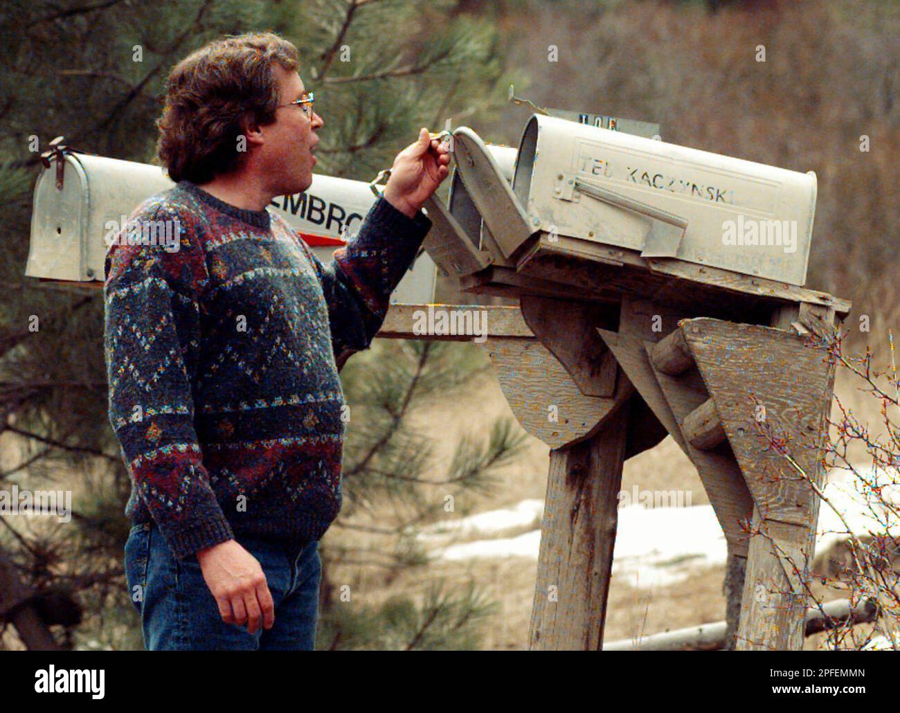 Tim Clavin, of Helena, Mont., sneaks a peek into the mailbox of ...