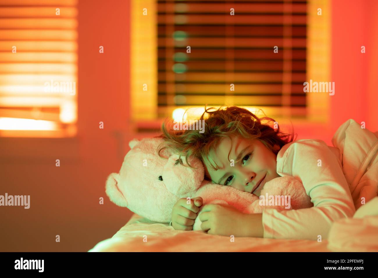 Good night. Cute boy trying to fall asleep. Sleepy child at naight ...