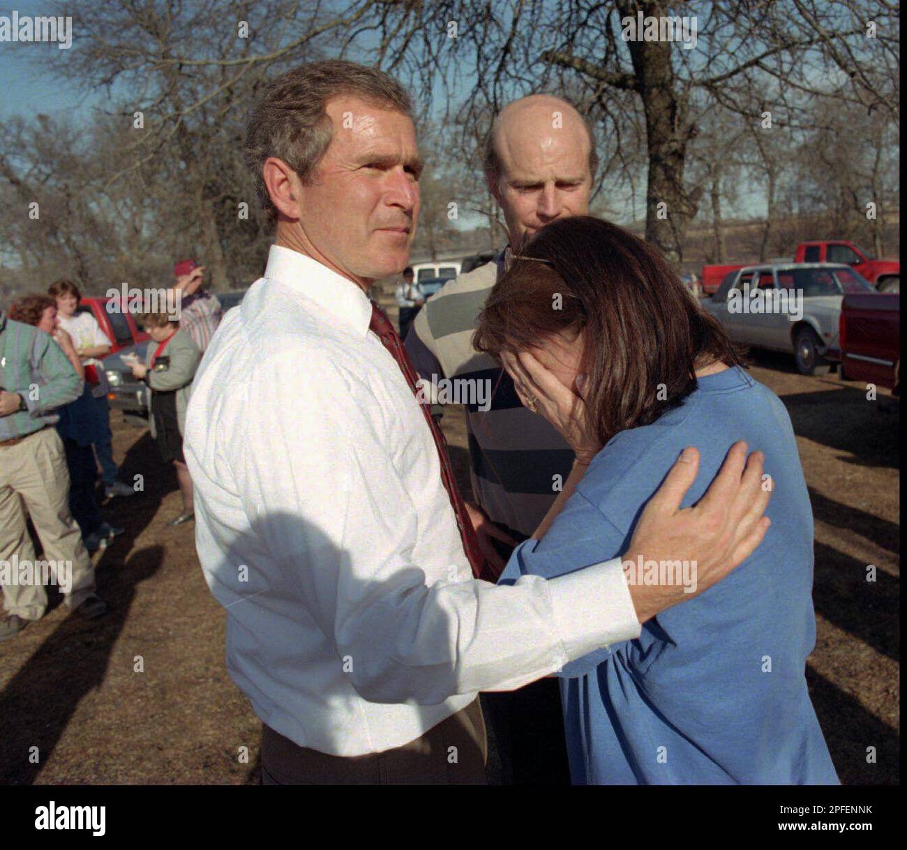 Texas Gov. George W. Bush and Rep. Pete Geren, D-Texas, try to console ...