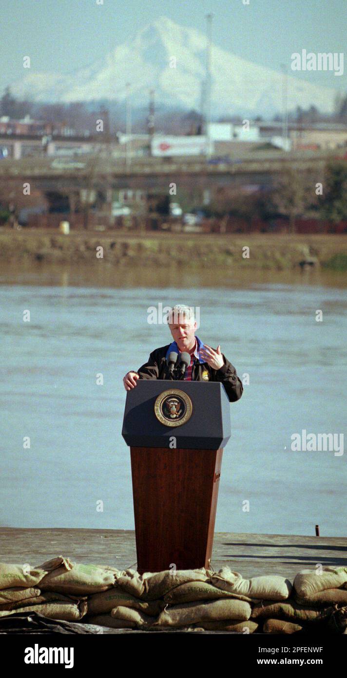 With Mt. Hood in the background, President Bill Clinton speaks at a ...