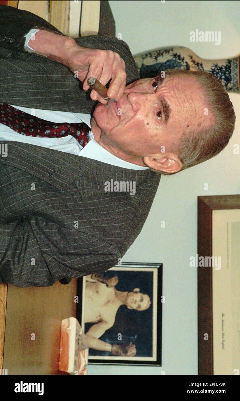 Former Alabama Gov. George C. Wallace is flanked by a 1935 photo of ...