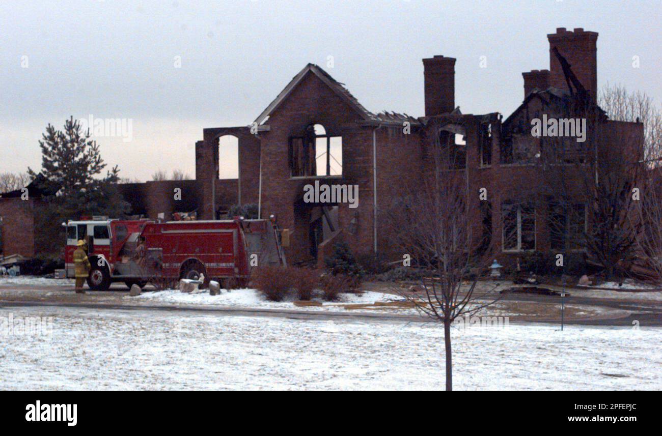 A fire engine is parked in front of the ruins Thursday, Jan. 25, 1996 ...