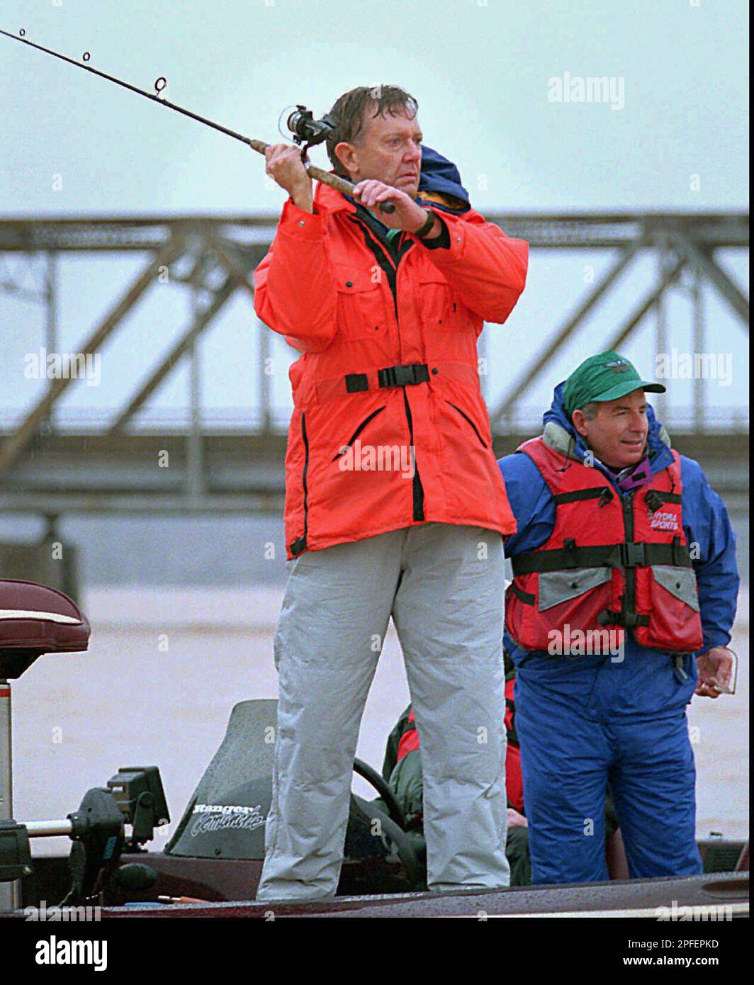 Interior Secretary Bruce Babbitt braves some nasty weather Wednesday ...