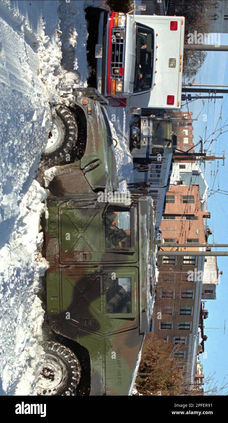 A Humvee vehicle operated by a National Guardsman struggles to maneuver ...