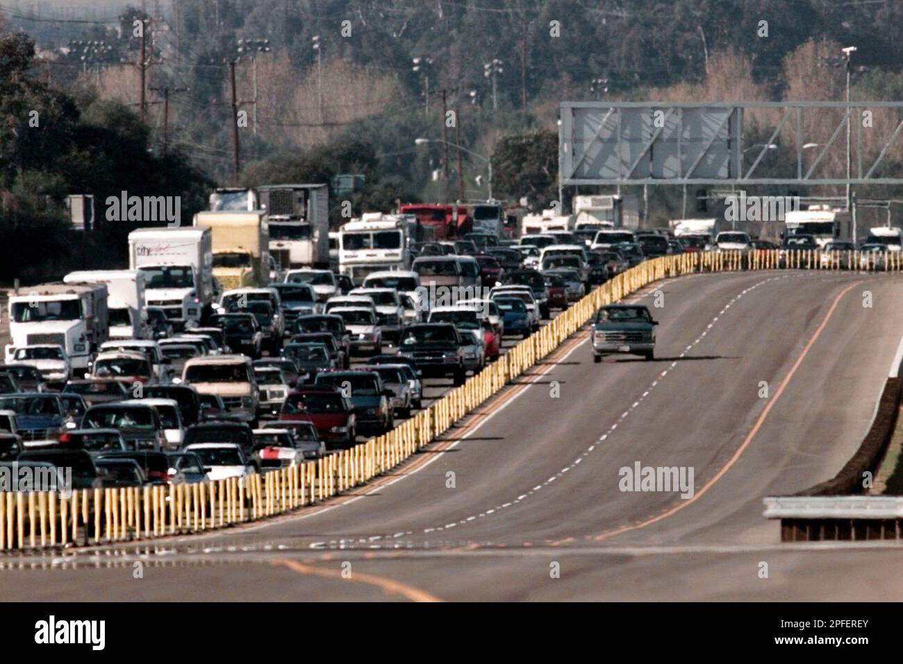 A freeway construction truck travels on part of the 10-mile stretch of ...