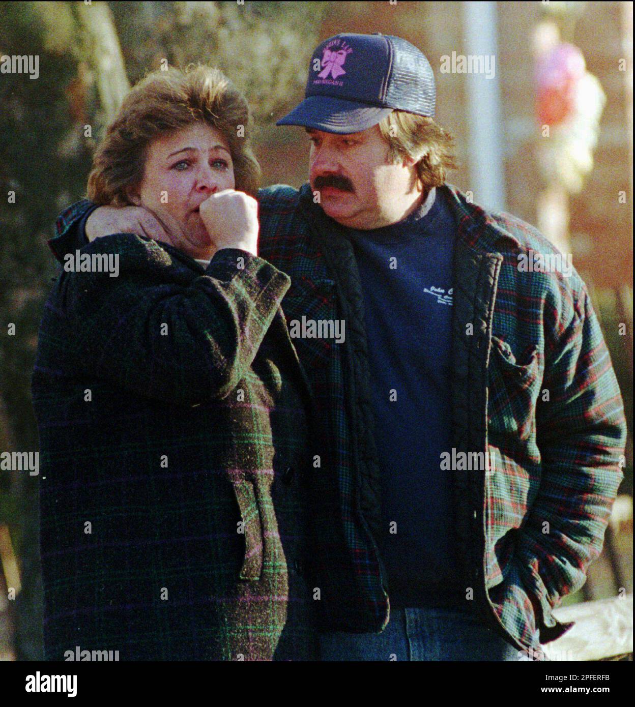 Richard Kanka, right, comforts his wife Maureen as she cries during ...