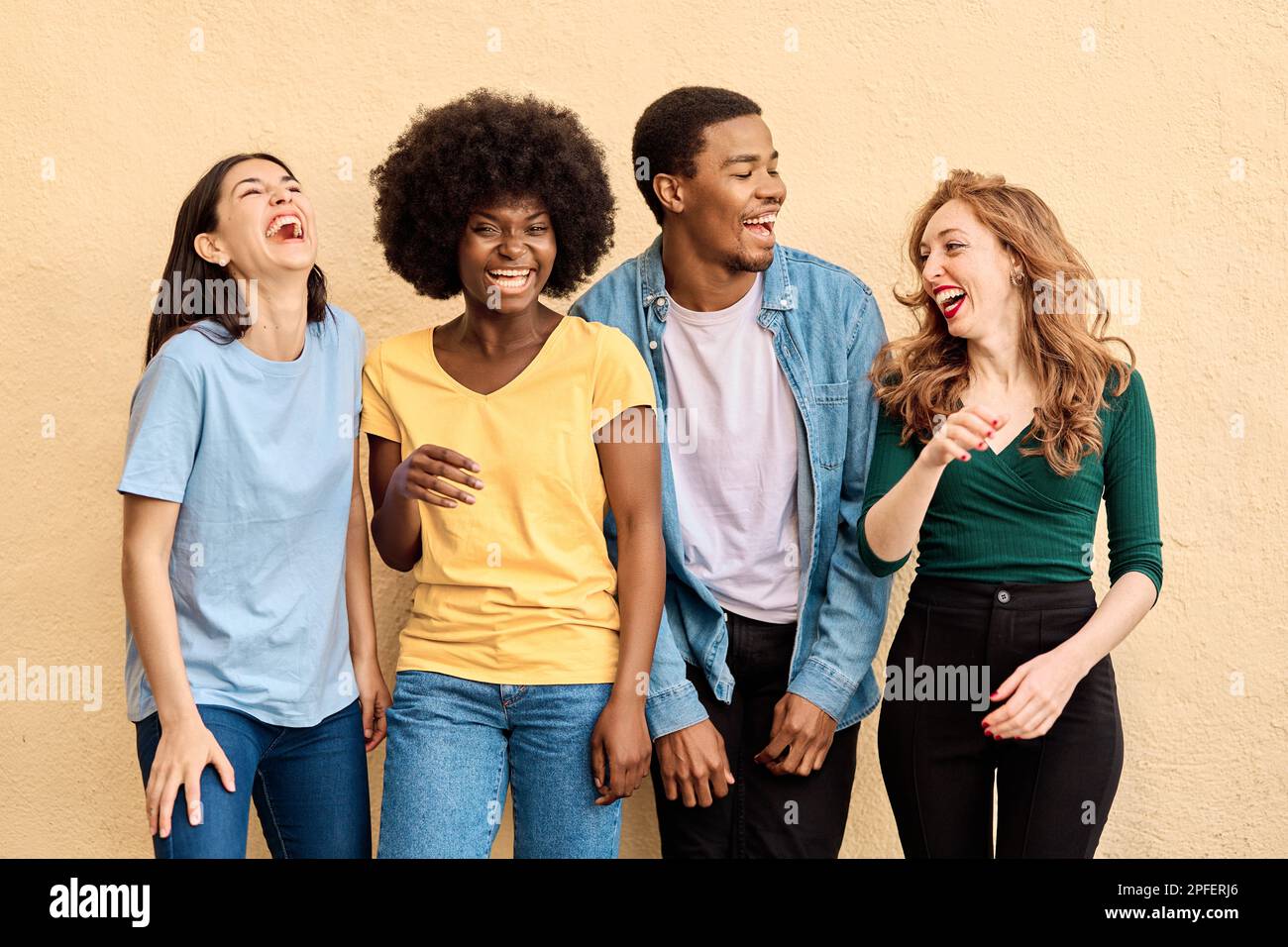 Studio portrait of happy multicultural people laughing Stock Photo - Alamy
