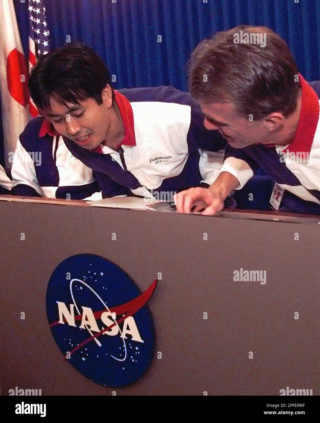 Japanese astronaut Koichi Wakata, left, and astronaut Brent Jett look ...