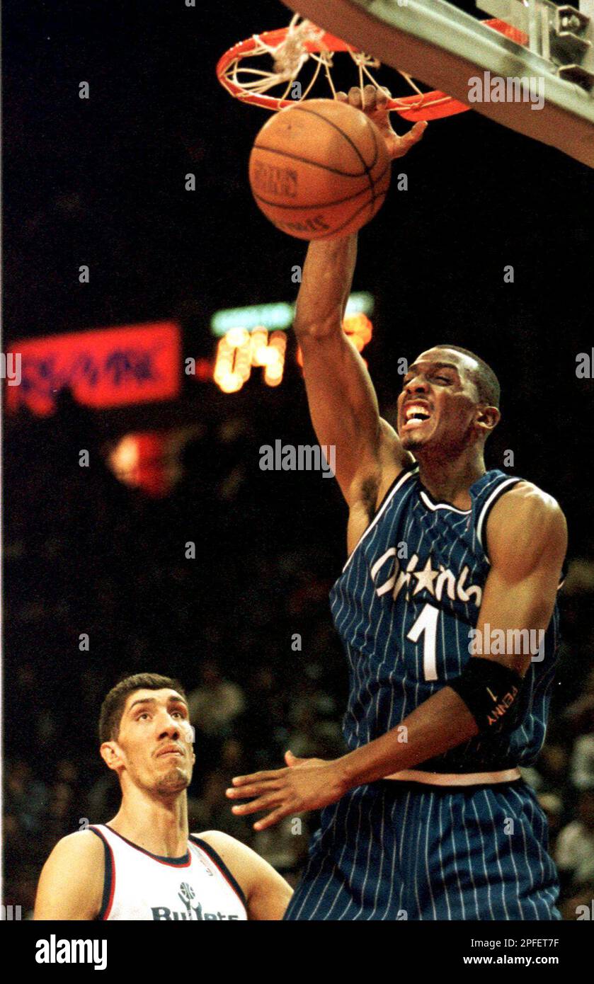 Orlando Magic's Penny Hardaway (1) dunks one over Washington Bullets ...