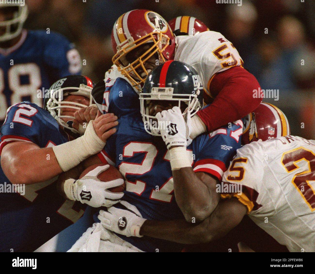 New York Giants' Rodney Hampton (27) fights for extra yards with the ...