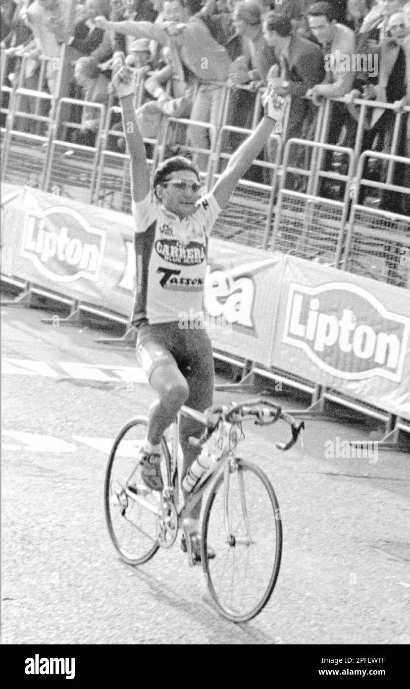 Italian cyclist star Claudio Chiappucci rises his arms as he crosses ...