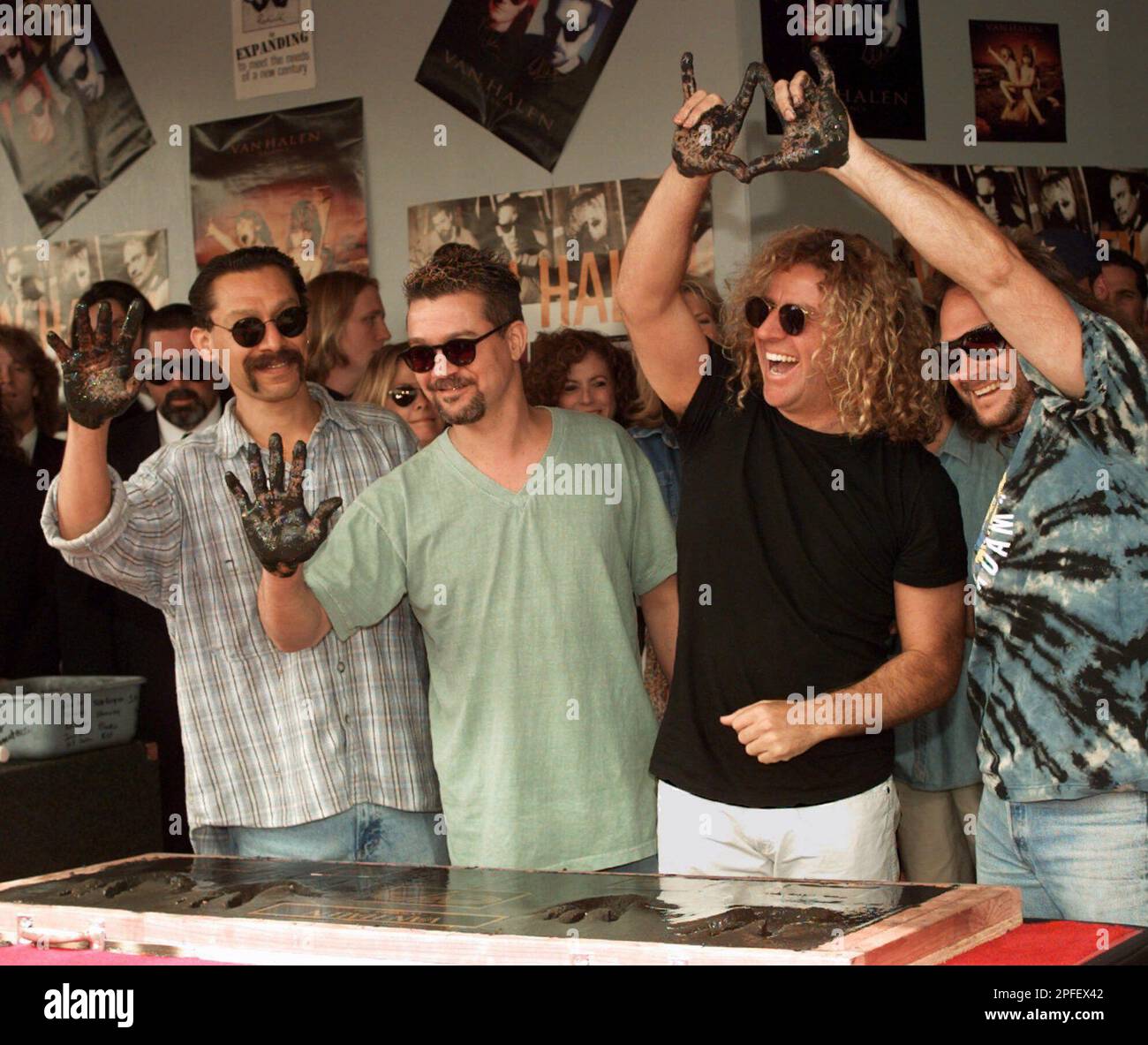 Members of the rock group Van Halen show off their cement covered hands ...