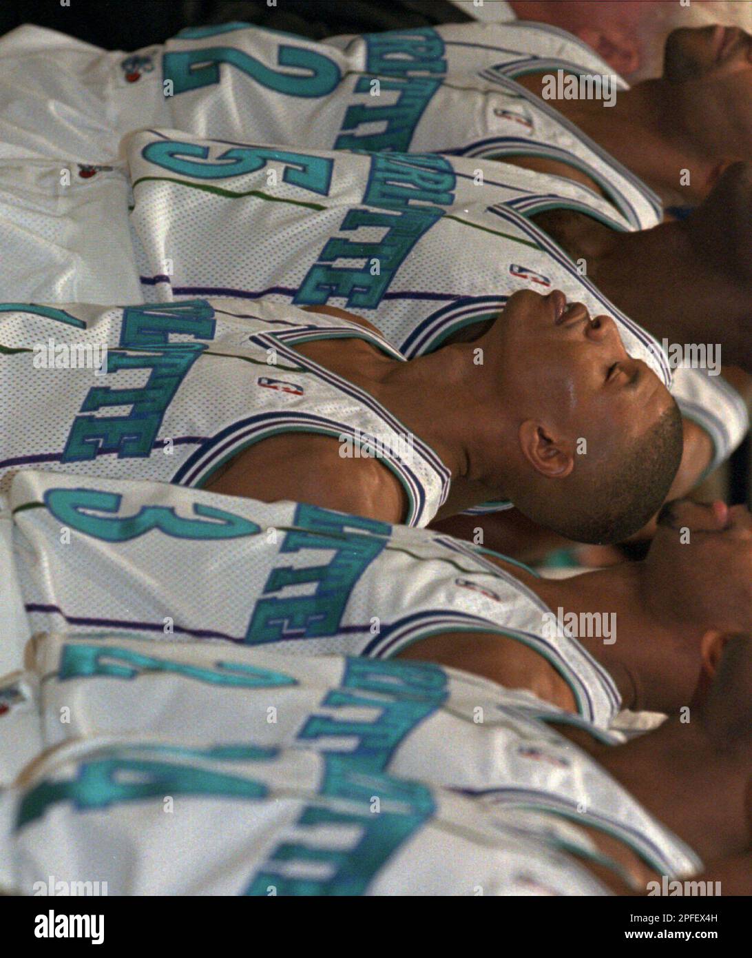 Charlotte Hornets Tyrone "Muggsy" Bogues closes his eyes as he waits ...