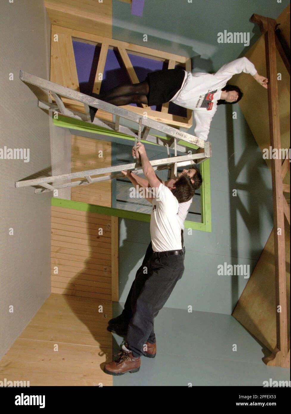 Kerike Lucas appears to have her ladder steadied by horizontal helpers ...