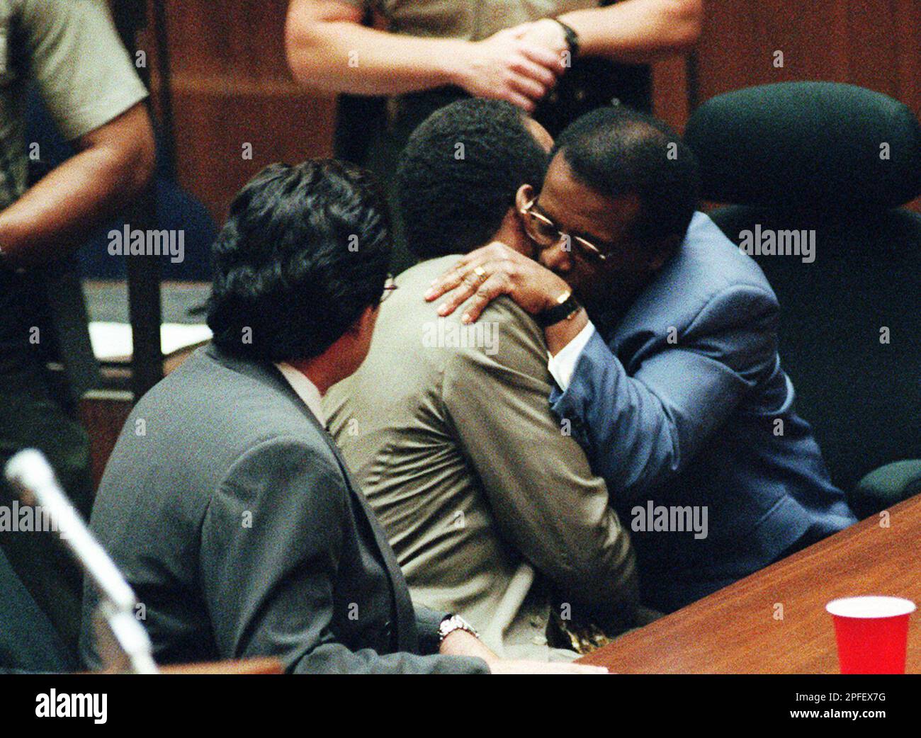 Attorney Johnnie Cochran Jr., right, hugs his client O.J. Simpson after ...