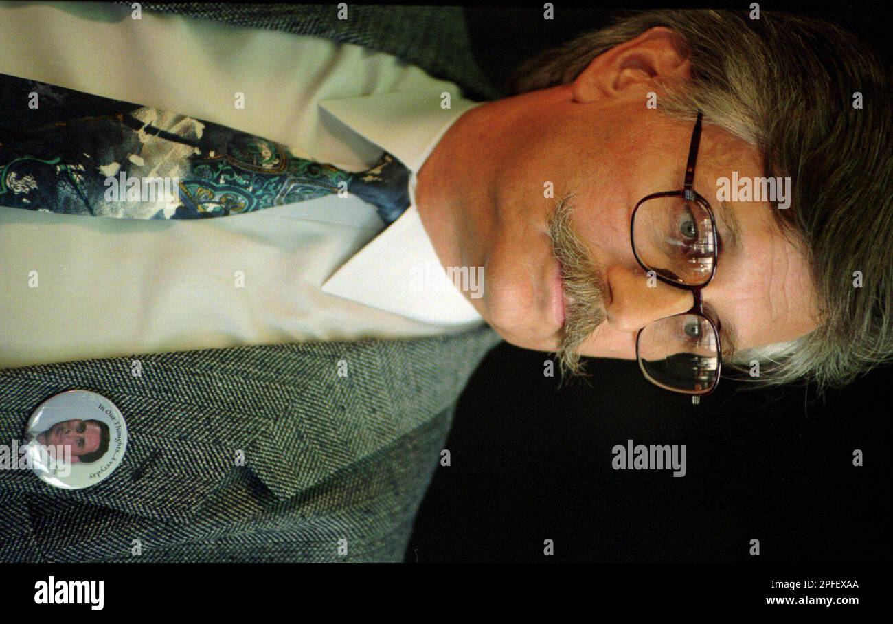 Fred Goldman, wearing a lapel button with a picture of his murdered son ...