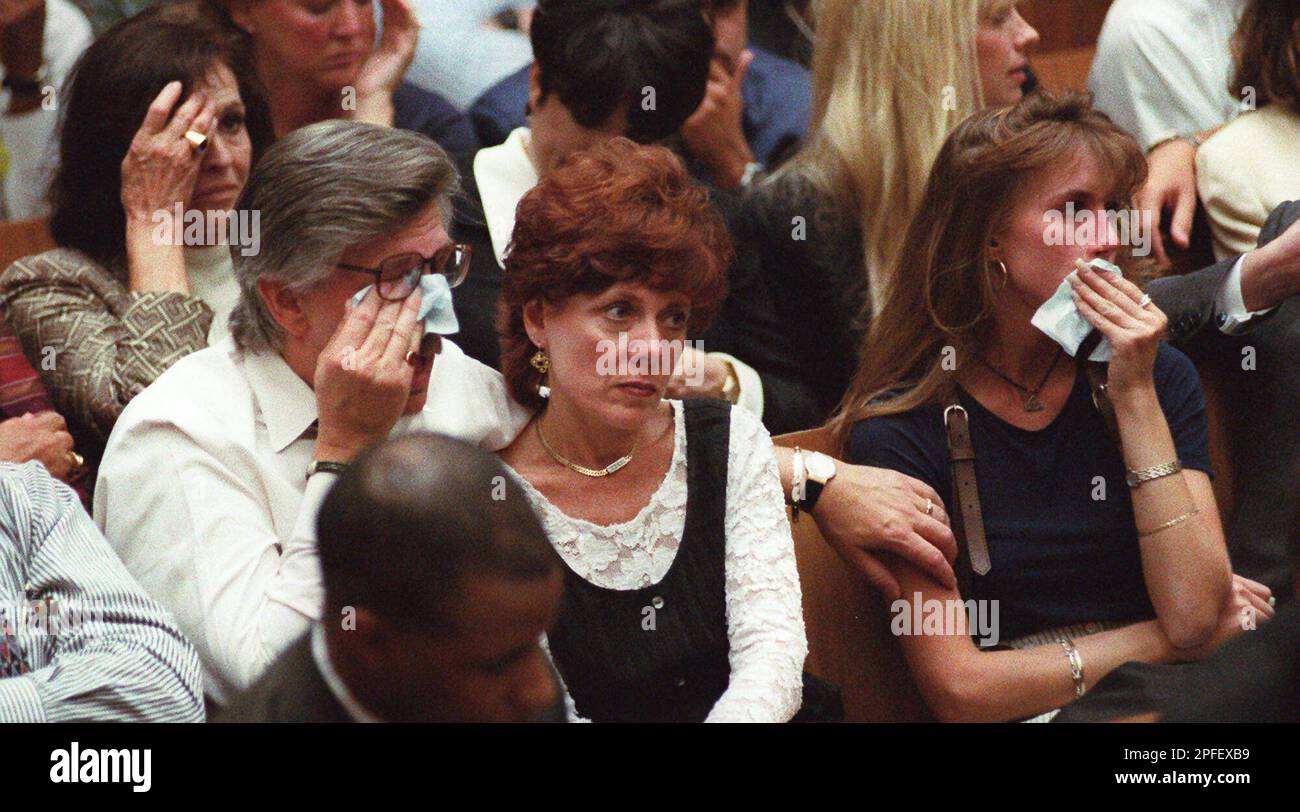 Ron Goldman's father Fred Goldman wipes a tear as his wife Patti ...