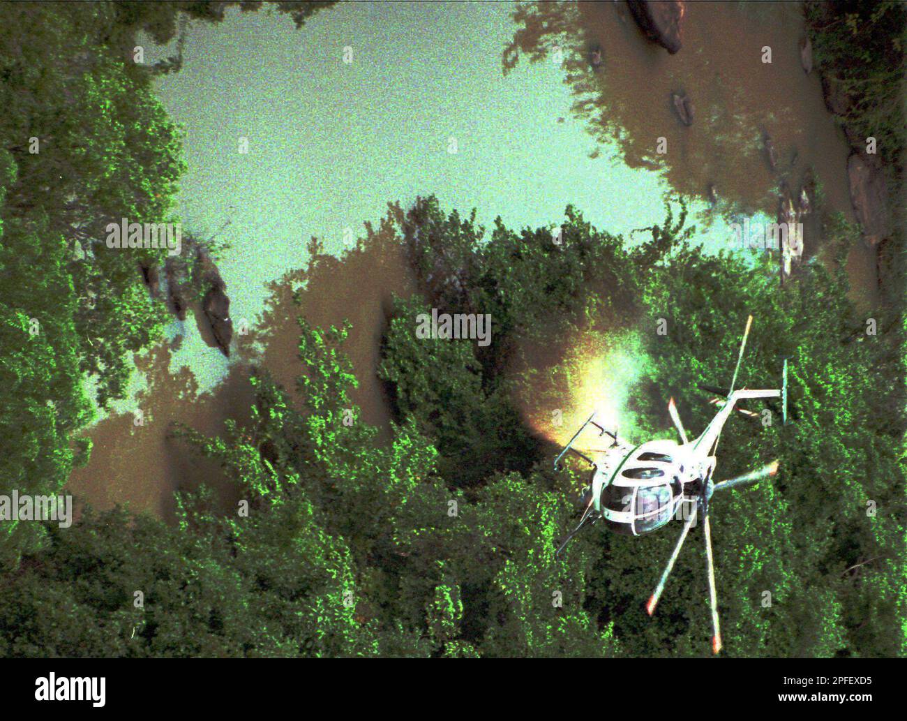An helicopter from the Onchocerciasis Contol Program (OCP) sprays ...