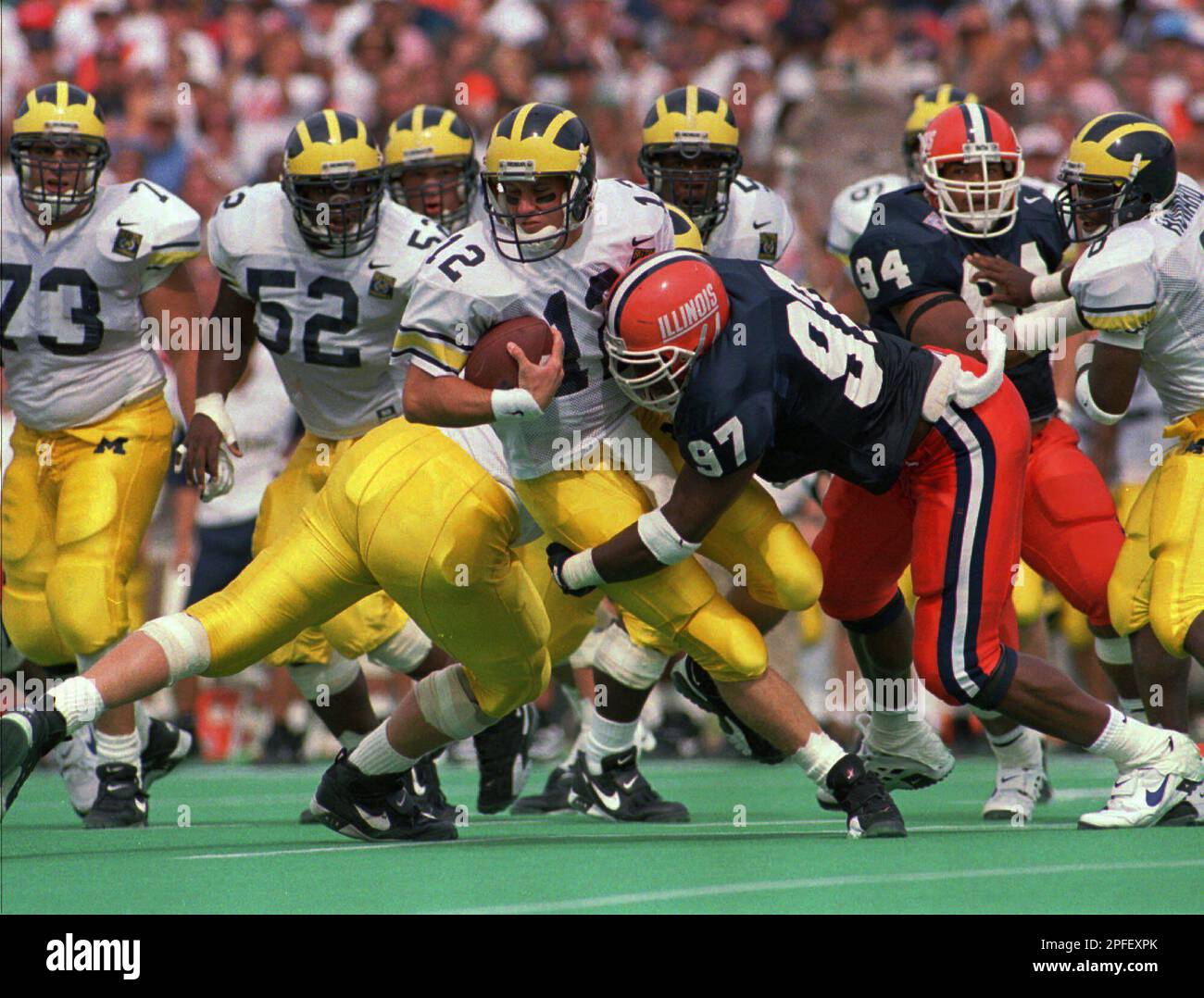 Illinois' Simeon Rice (97) breaks through and sacks Michigan ...