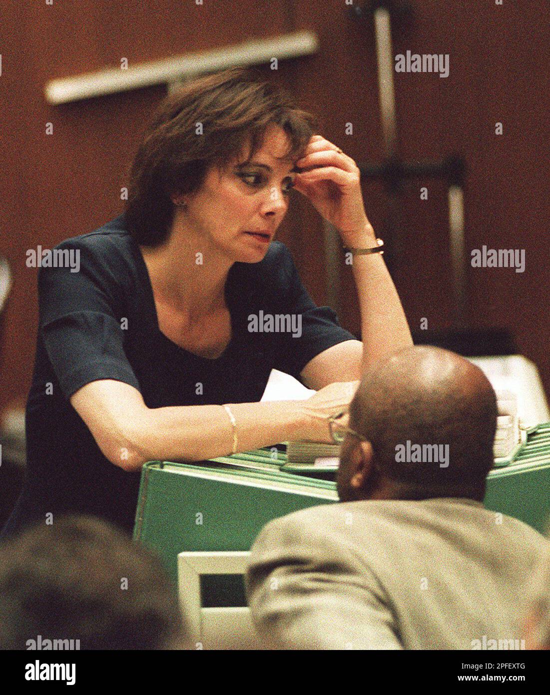 Prosecutor Marcia Clark mulls over transcripts during prosecution ...