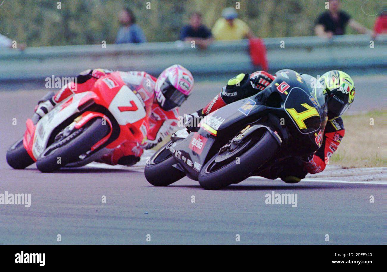 Max Biaggi, right, of Italy on Aprilia 250cc and Tetsuya Harada of ...