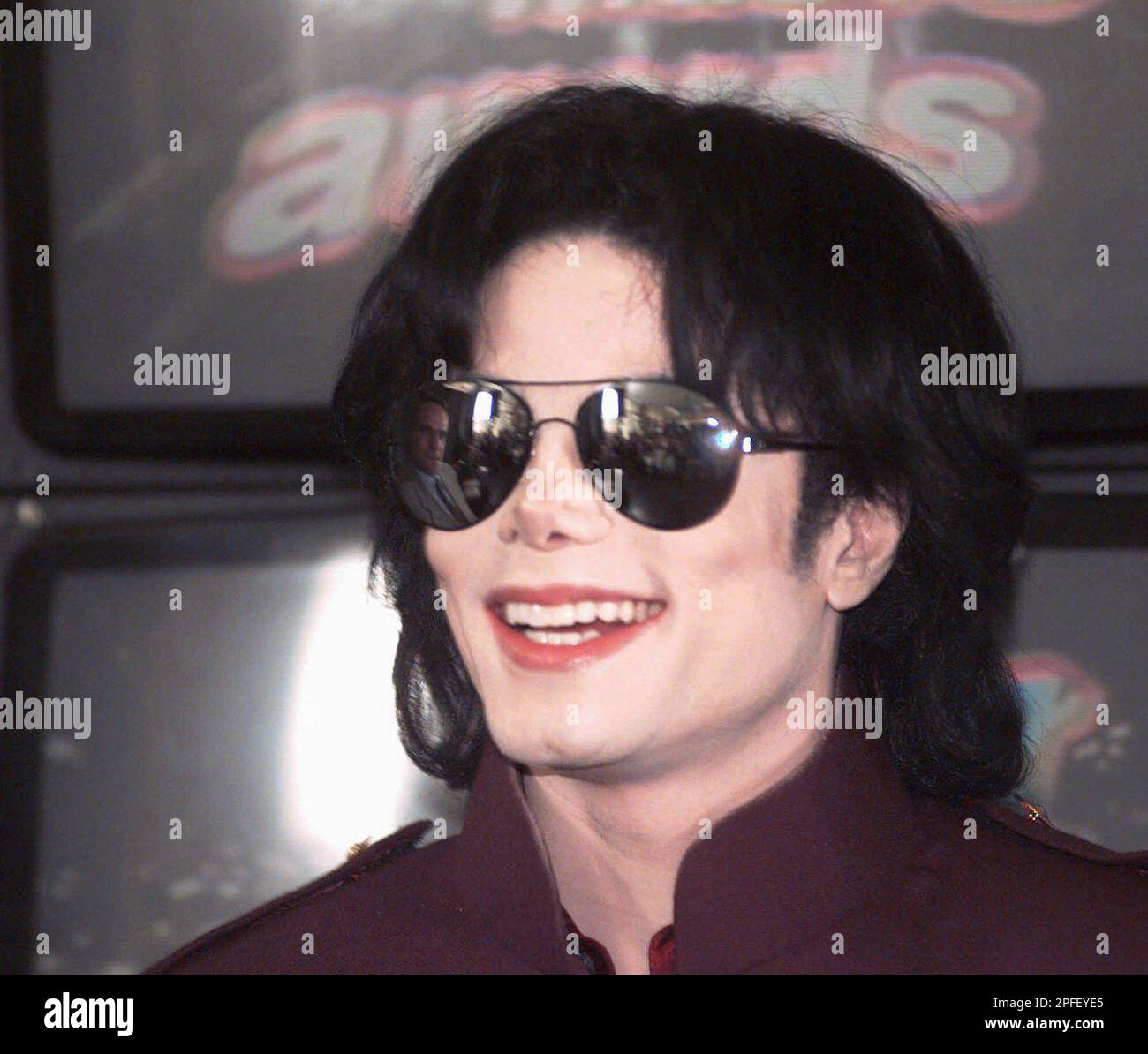 Rock superstar Michael Jackson smiles for cameras at the announcement ...