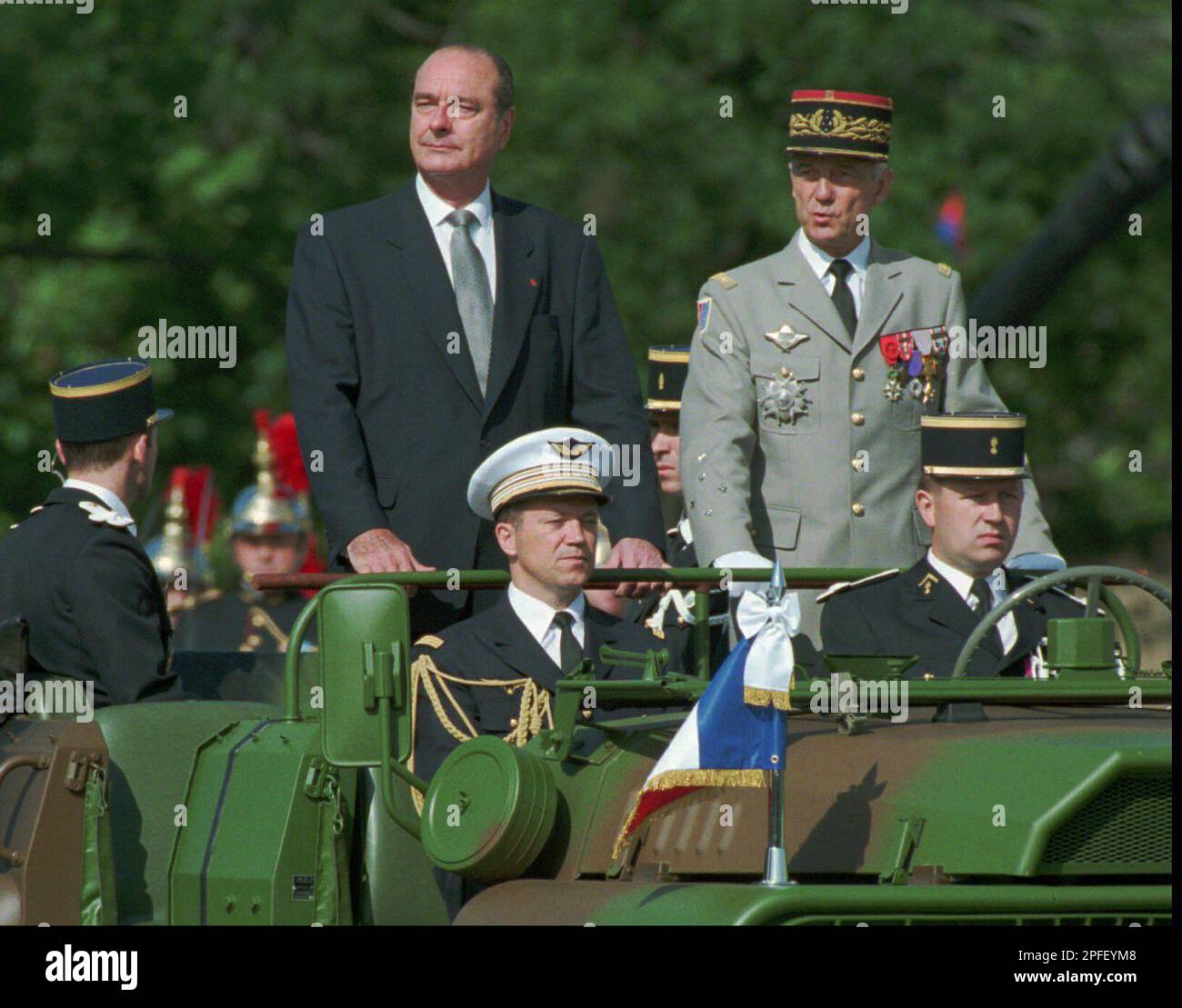 French President Jacques Chirac, left, reviews troops with General ...