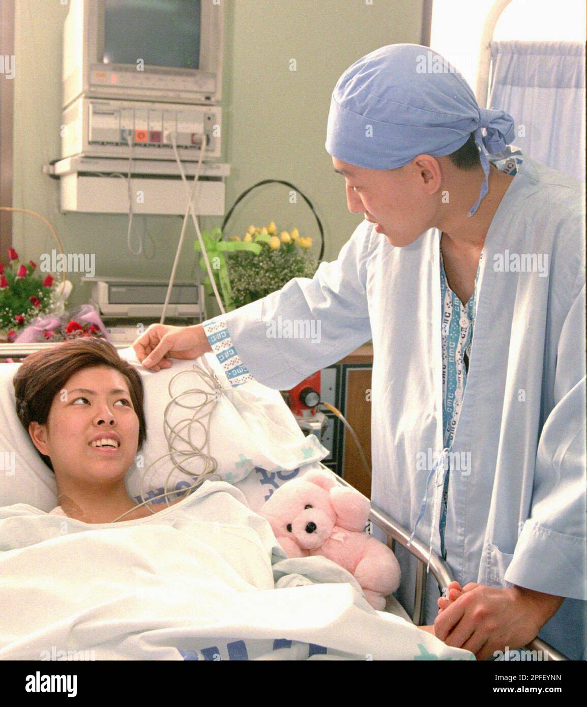 Survivor Park Sung-hyun, left, is comforted by earlier survivor Choi Myoung-suk during a medical ...