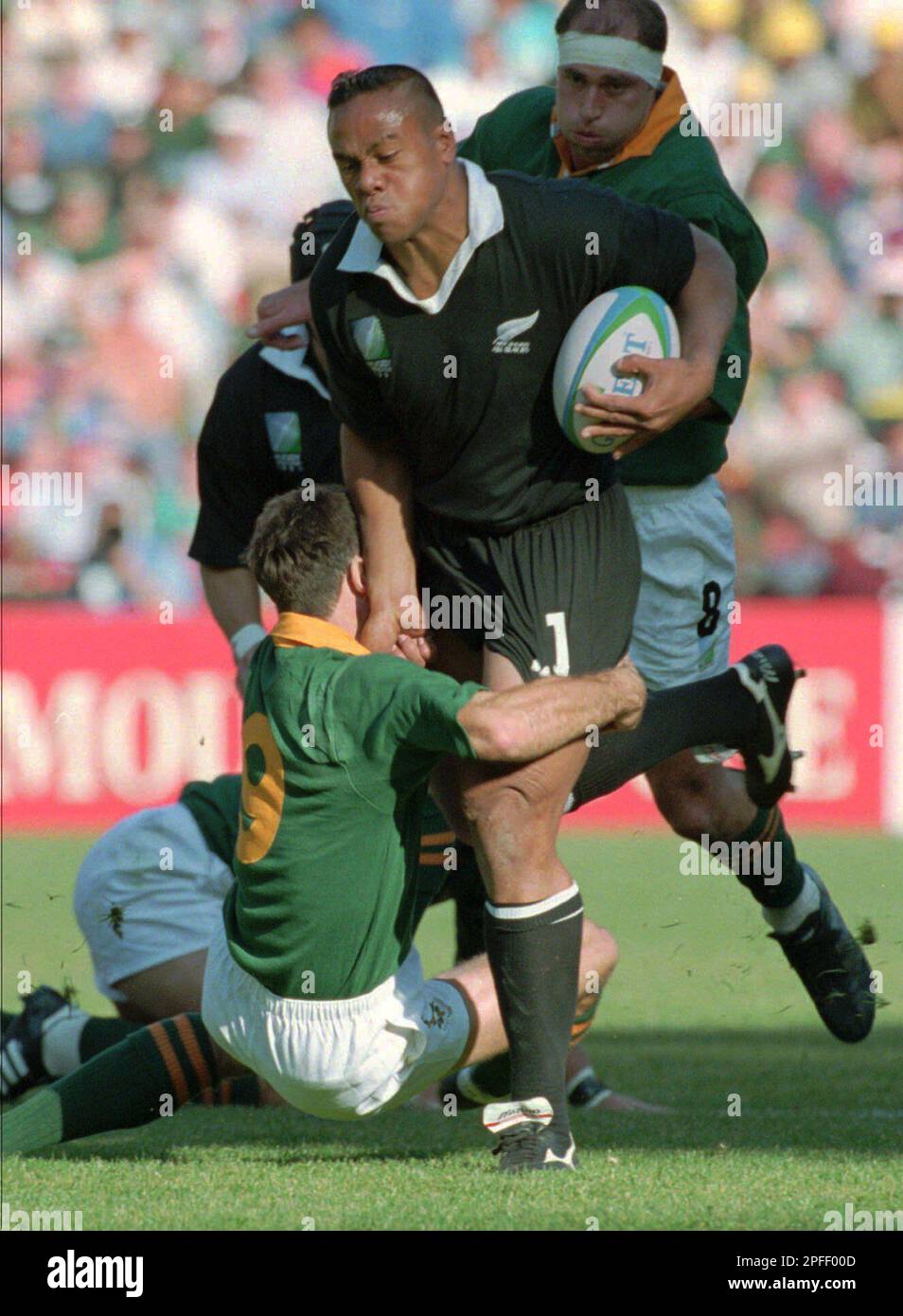 New Zealand winger Jonah Lomu crashes through a tackle during the World ...