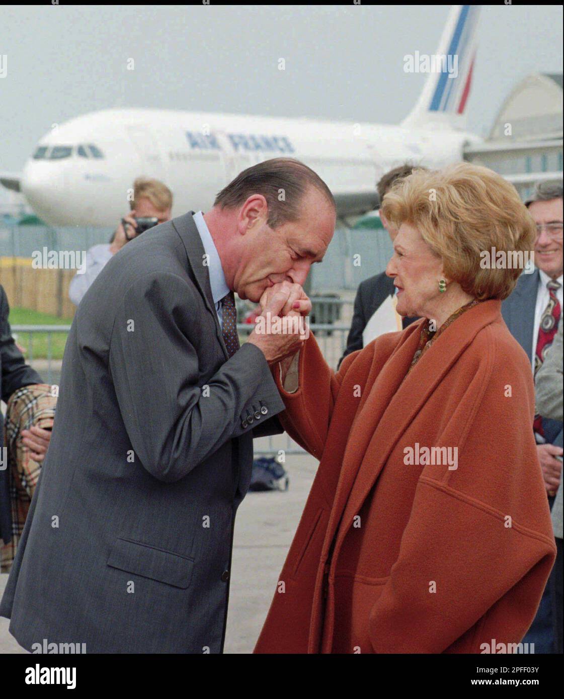 French President Jacques Chirac kisses the hand of U.S ambassador ...