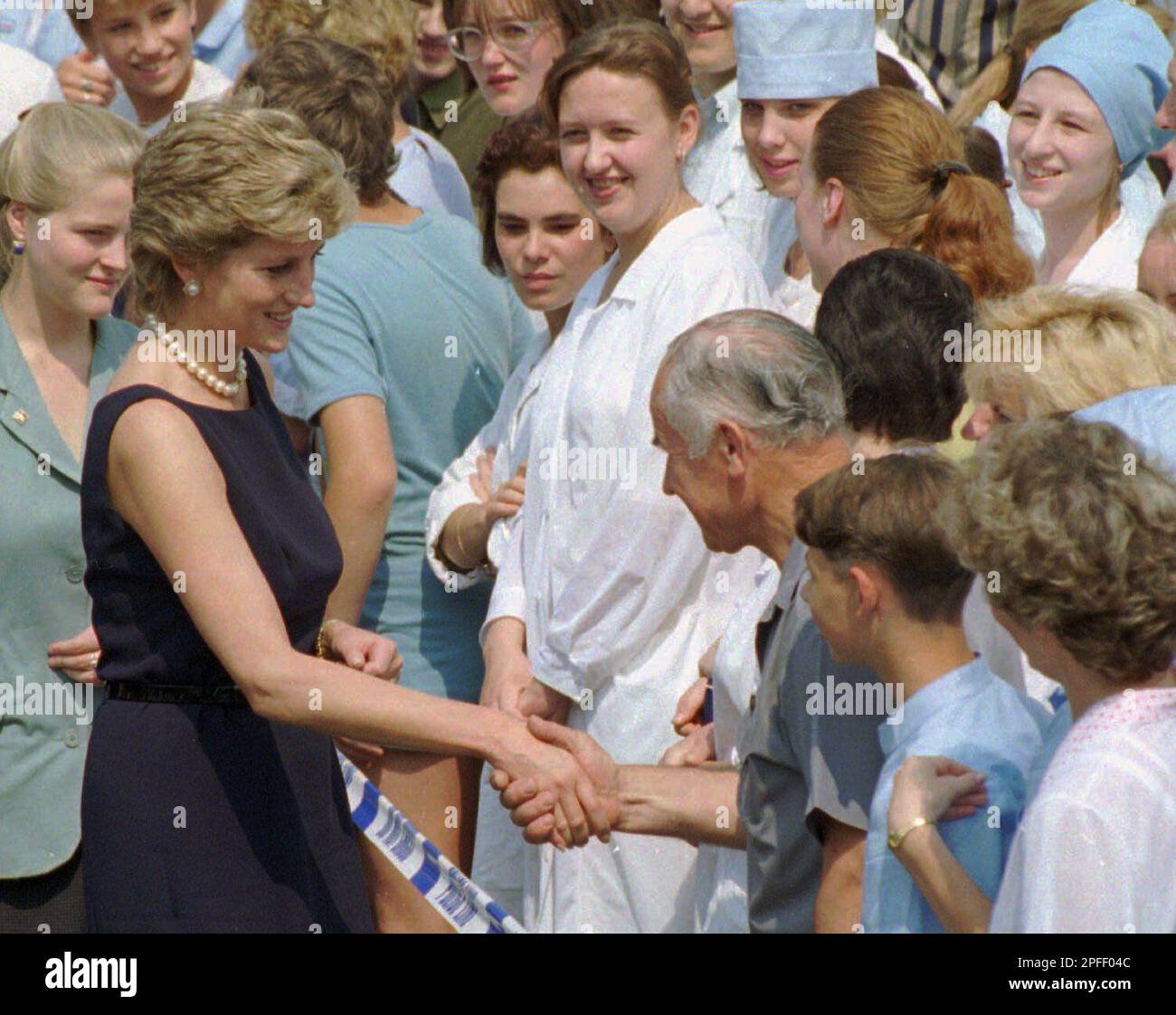 The Princess of Wales shakes hands with employees outside Moscow's ...